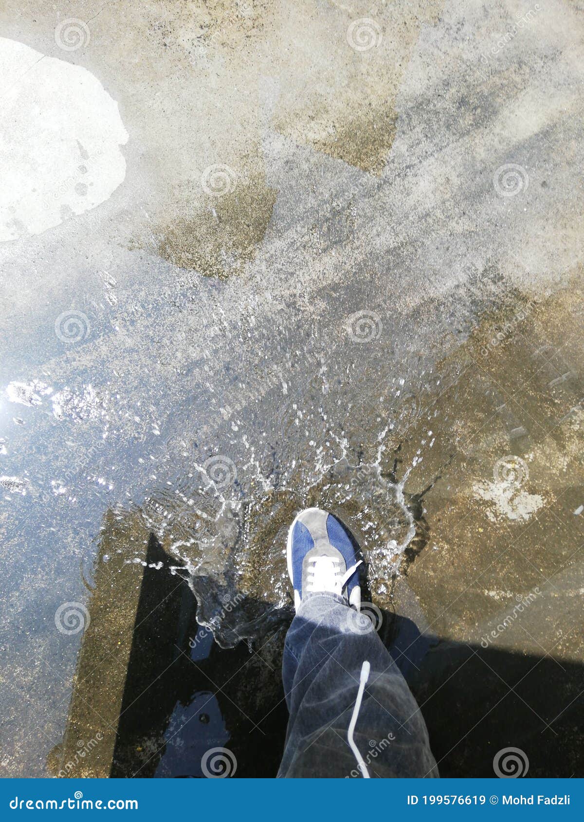 Man Stepping in the Water Puddle Stock Image - Image of freezing, rock ...
