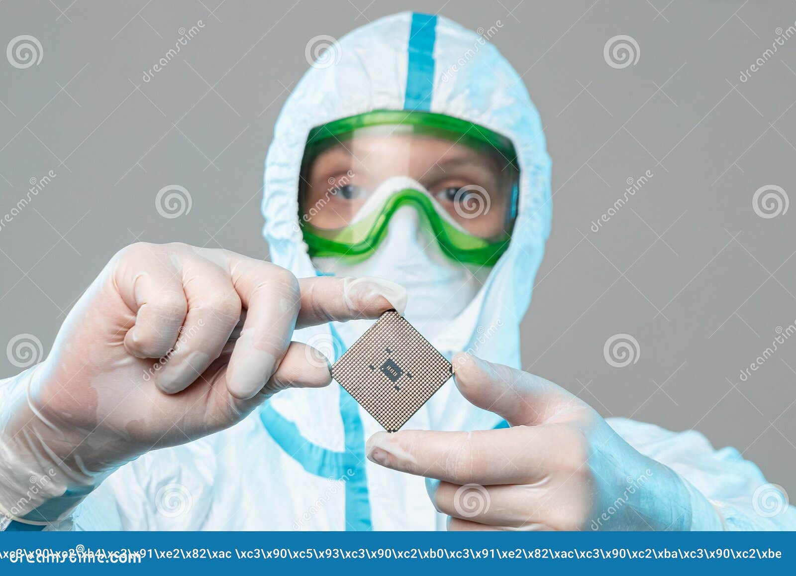 A Man In Sterile Form Holds A Microprocessor In His Hands, Close-up ...