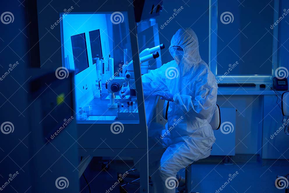Man in a Sterile Uniform Uses a Micromanipulator Set Stock Image ...