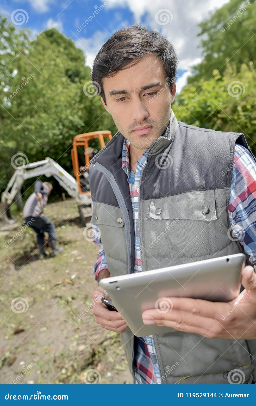 Man Stood in Garden Holding Tablet Stock Photo - Image of person ...