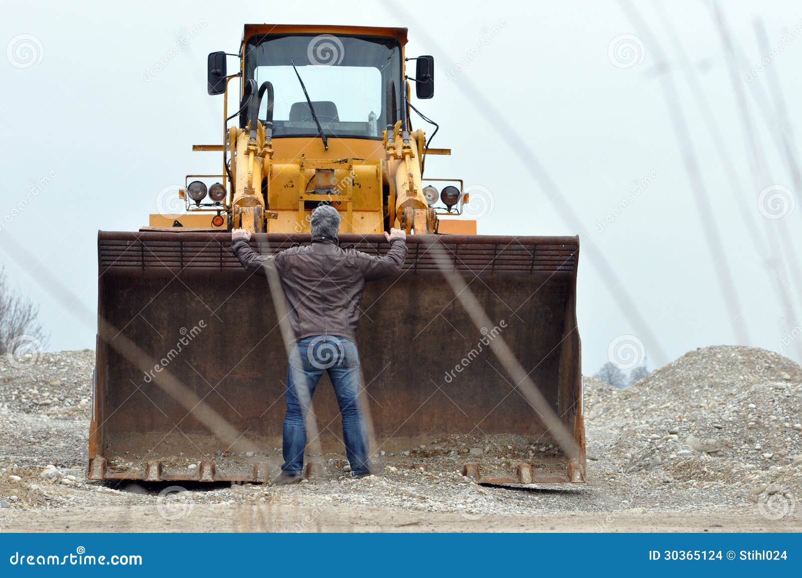 Man stops big wheel loader stock photo. Image of dredger - 30365124