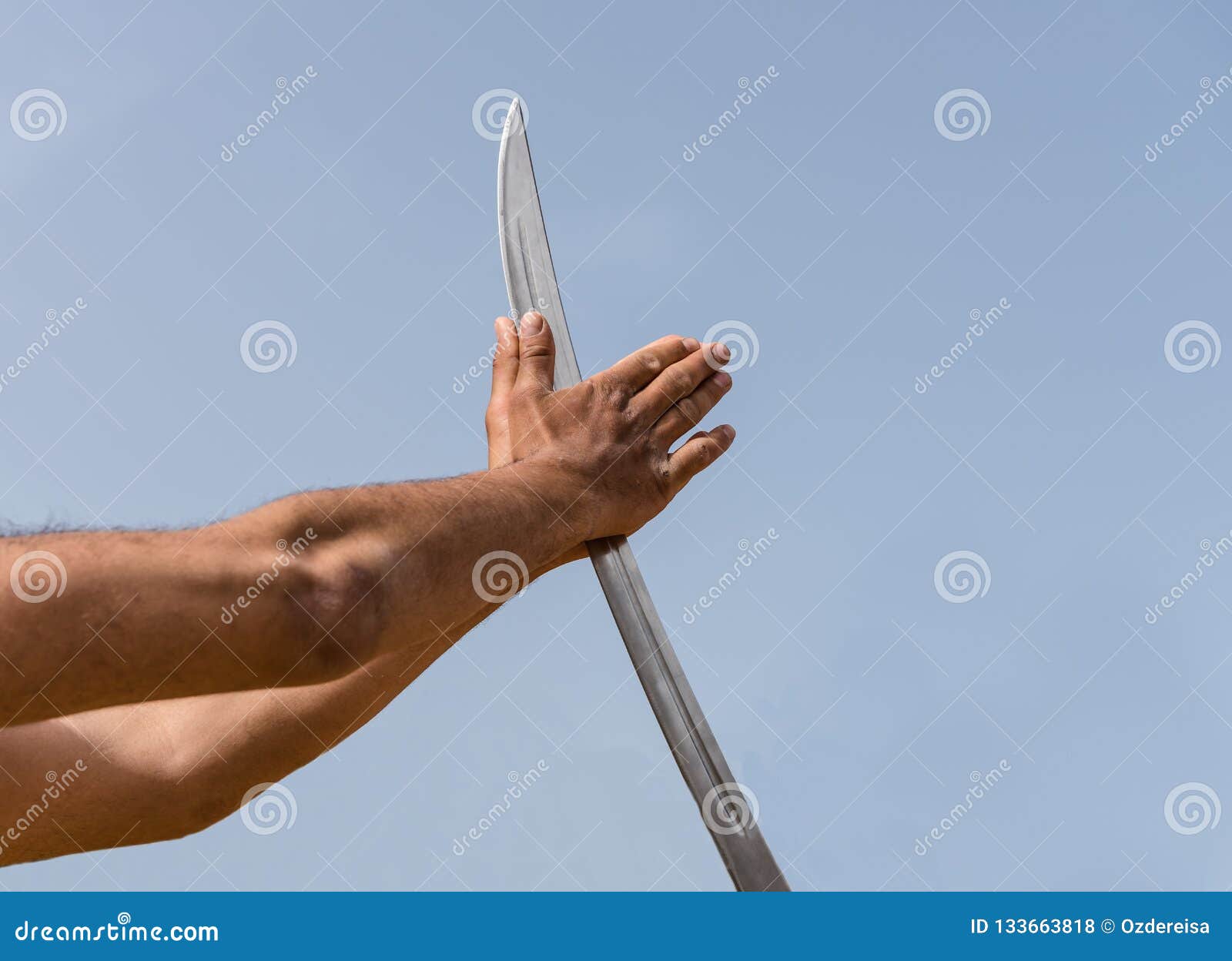 Man Stops Sword with Two Hands Stock Photo - Image of etnospor, game ...