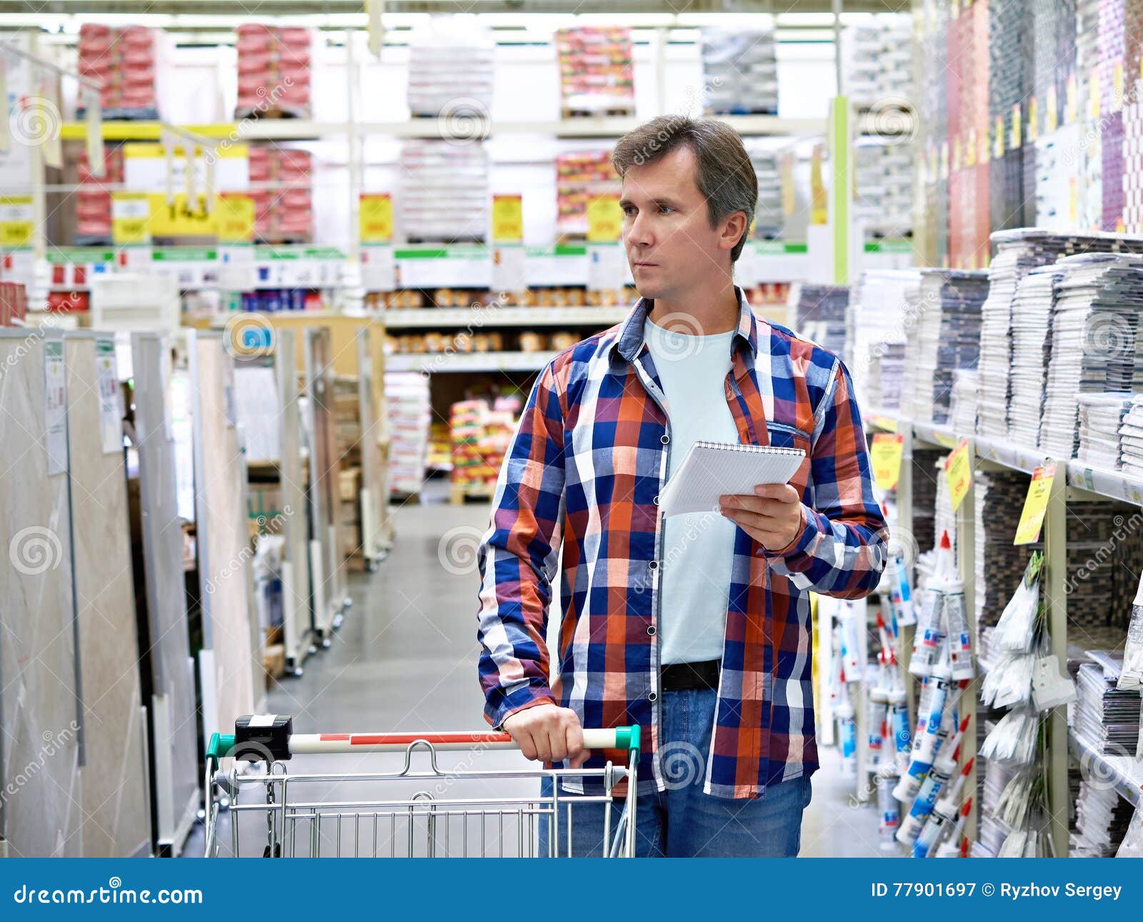 Man in Store Building Materials Stock Image - Image of person, holding ...