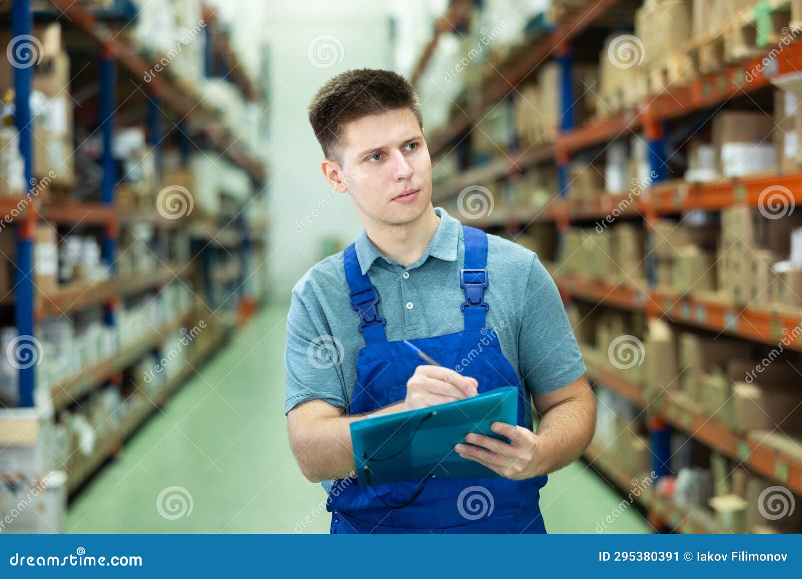 Man Storekeeper Keeps Track of Goods on the Shelves of Construction ...