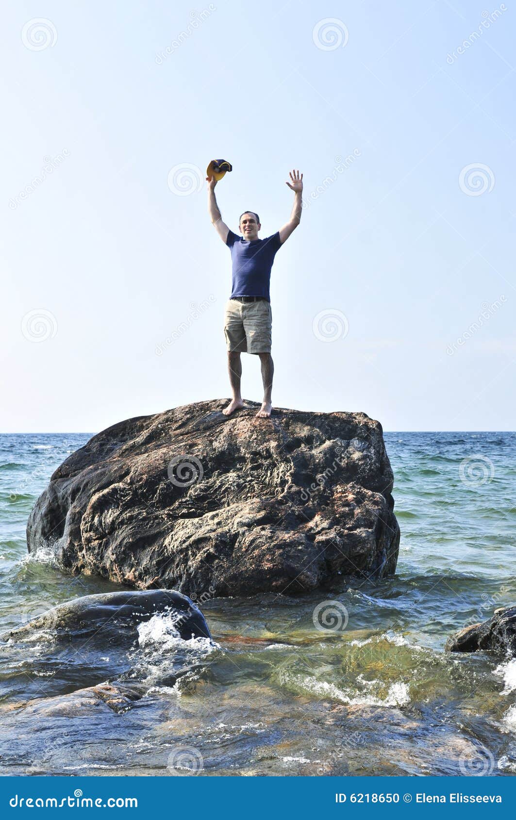 Man Stranded on a Rock in Ocean Stock Photo - Image of adult, middle ...