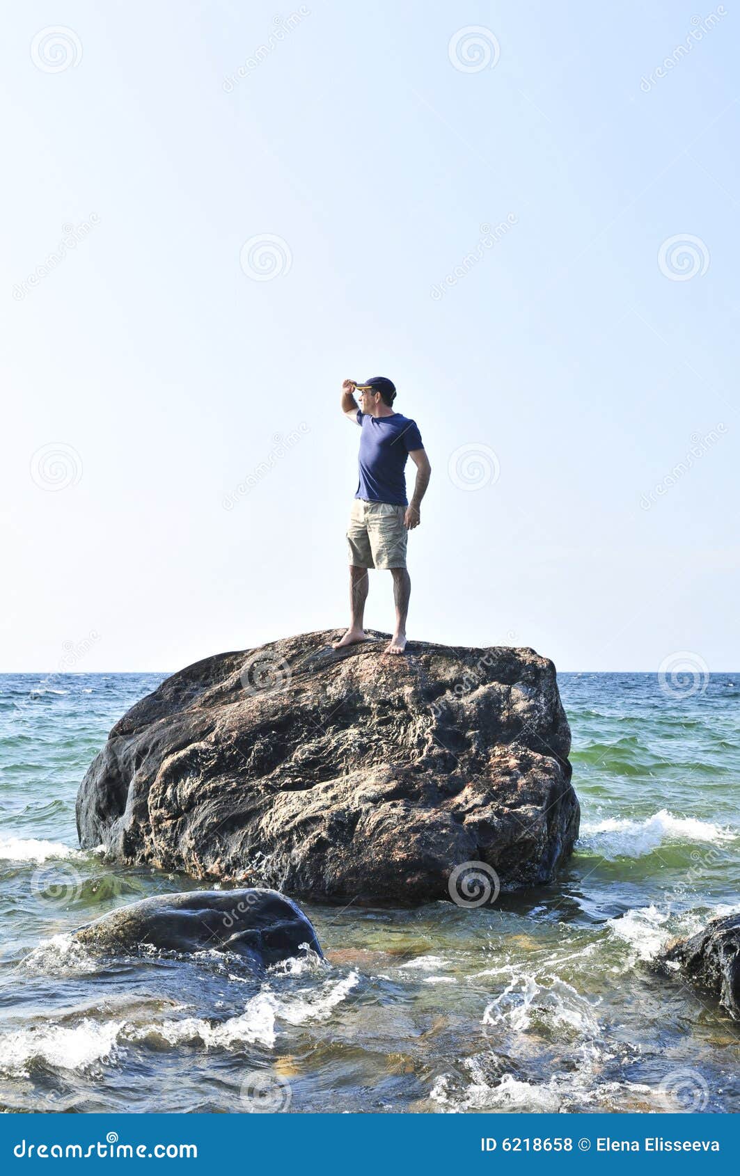 Man Stranded on a Rock in Ocean Stock Photo - Image of marooned ...