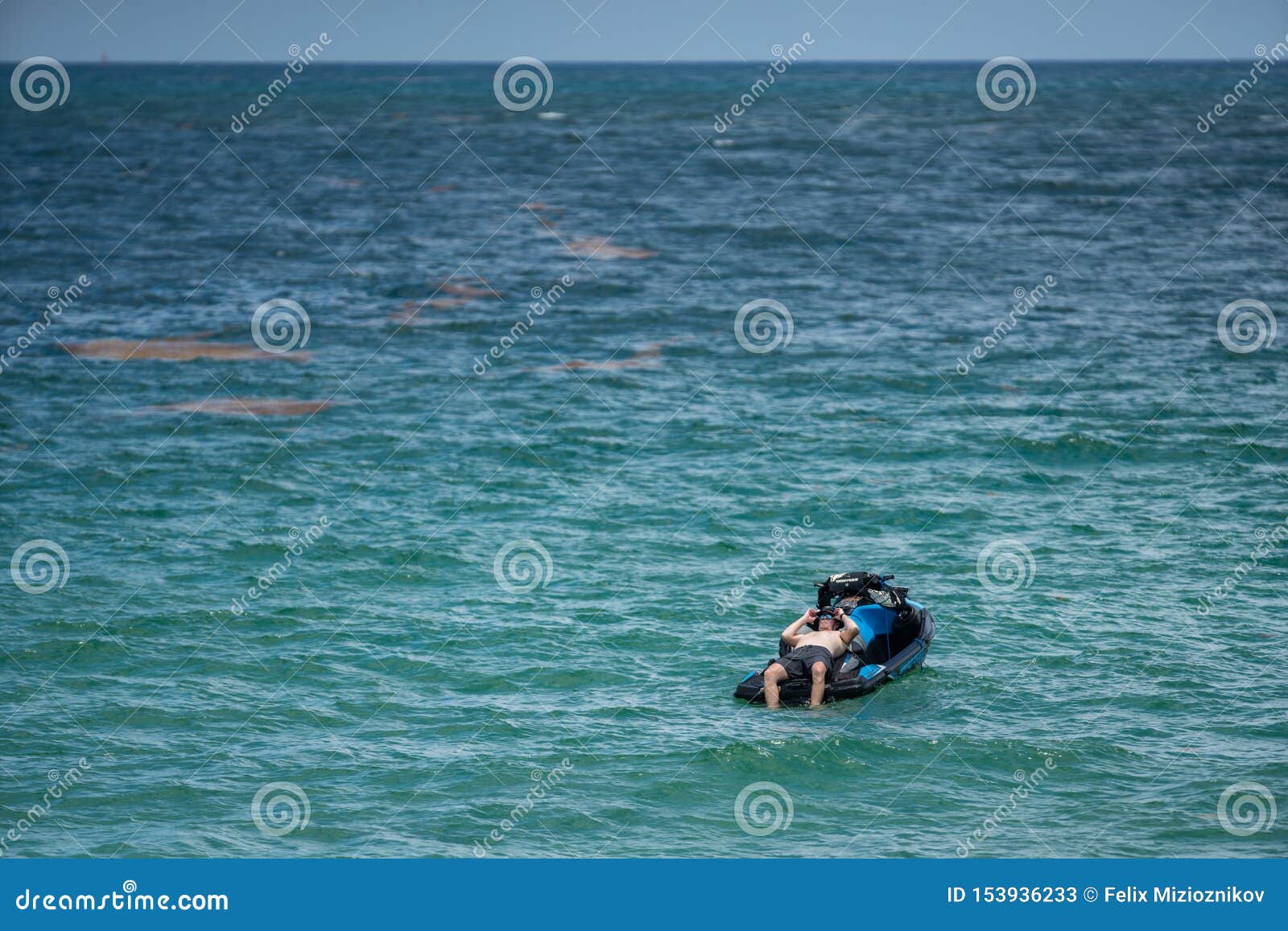 Man Stranded on a Wave Runner in the Ocean Waiting for Rescue To Arrive ...