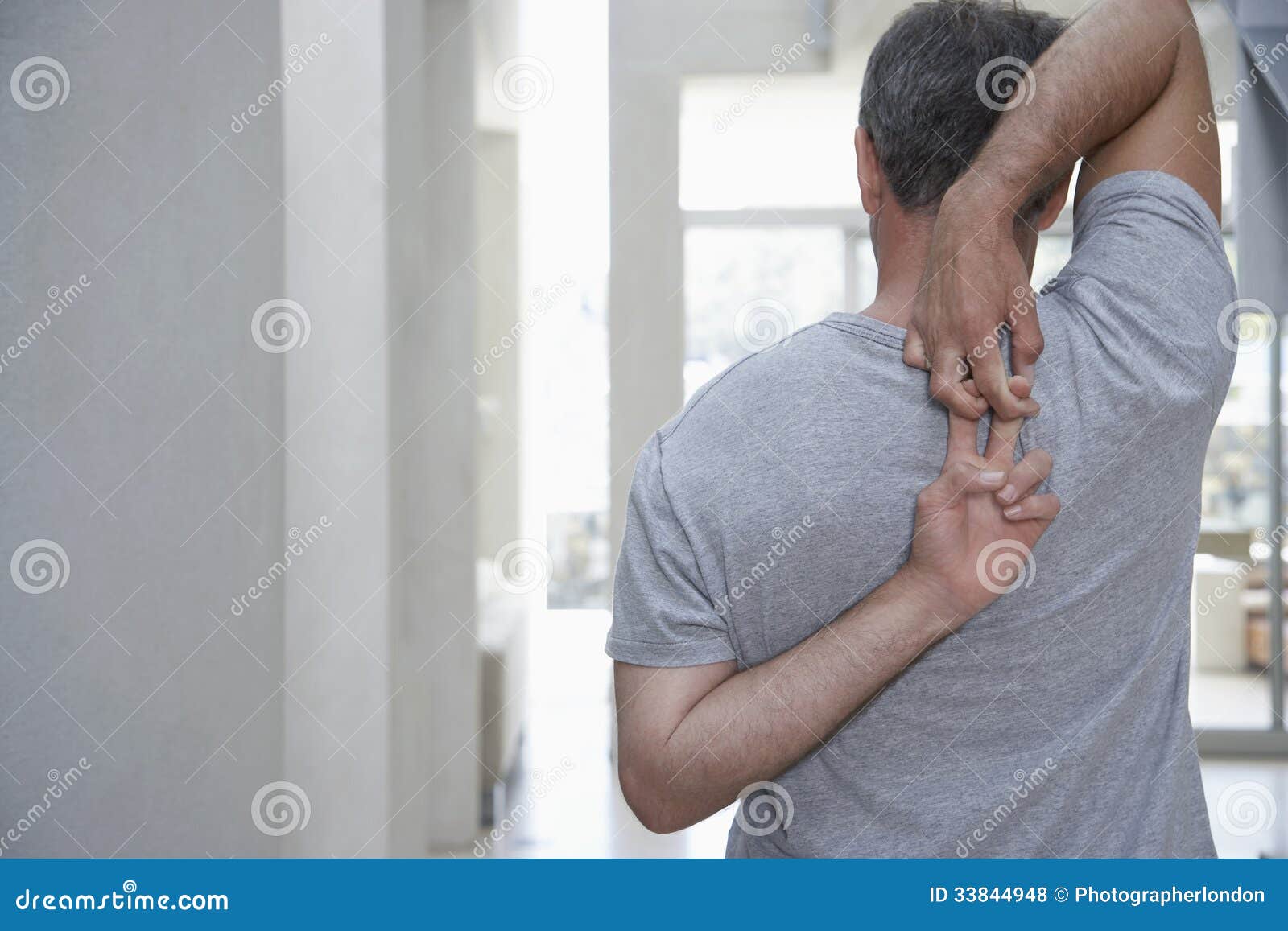 Man Stretching Arms Behind Back Stock Photo - Image of leisure, people ...