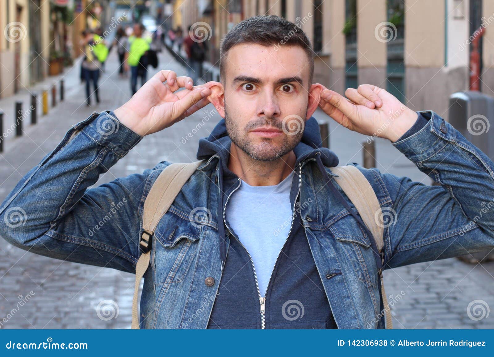 Man Stretching His Ears Outdoors Stock Photo - Image of joke, glad ...