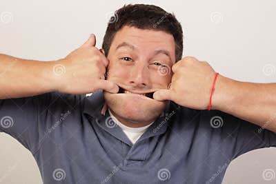 Man stretching his face stock image. Image of face, undress - 21646613