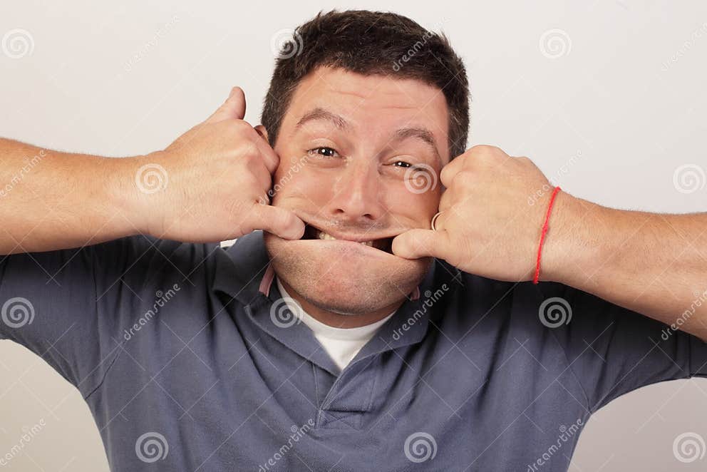 Man stretching his face stock image. Image of face, undress - 21646613