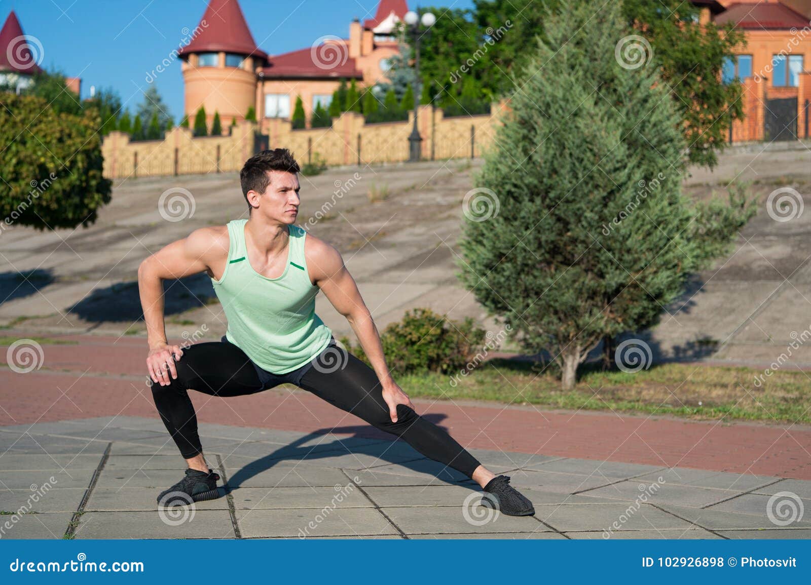 Man Stretching and Warming Up Muscles before Workout Stock Photo ...