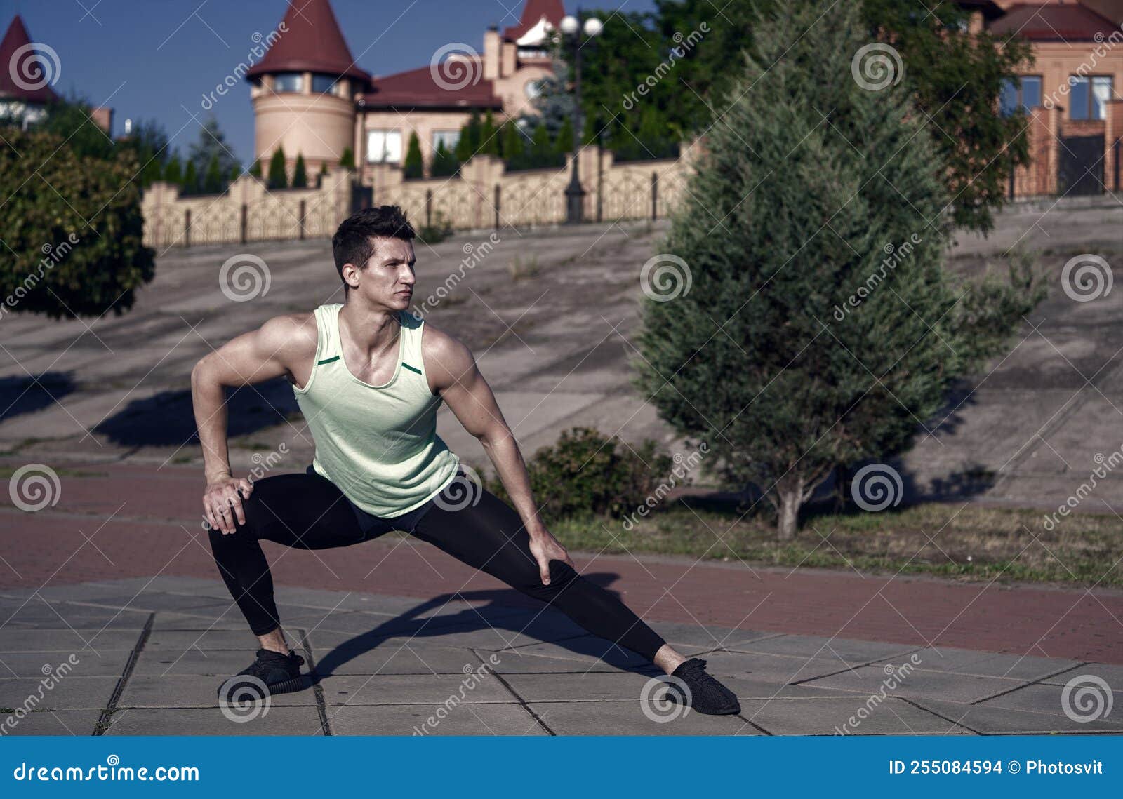 Man Stretching and Warming Up Muscles before Workout Stock Photo ...