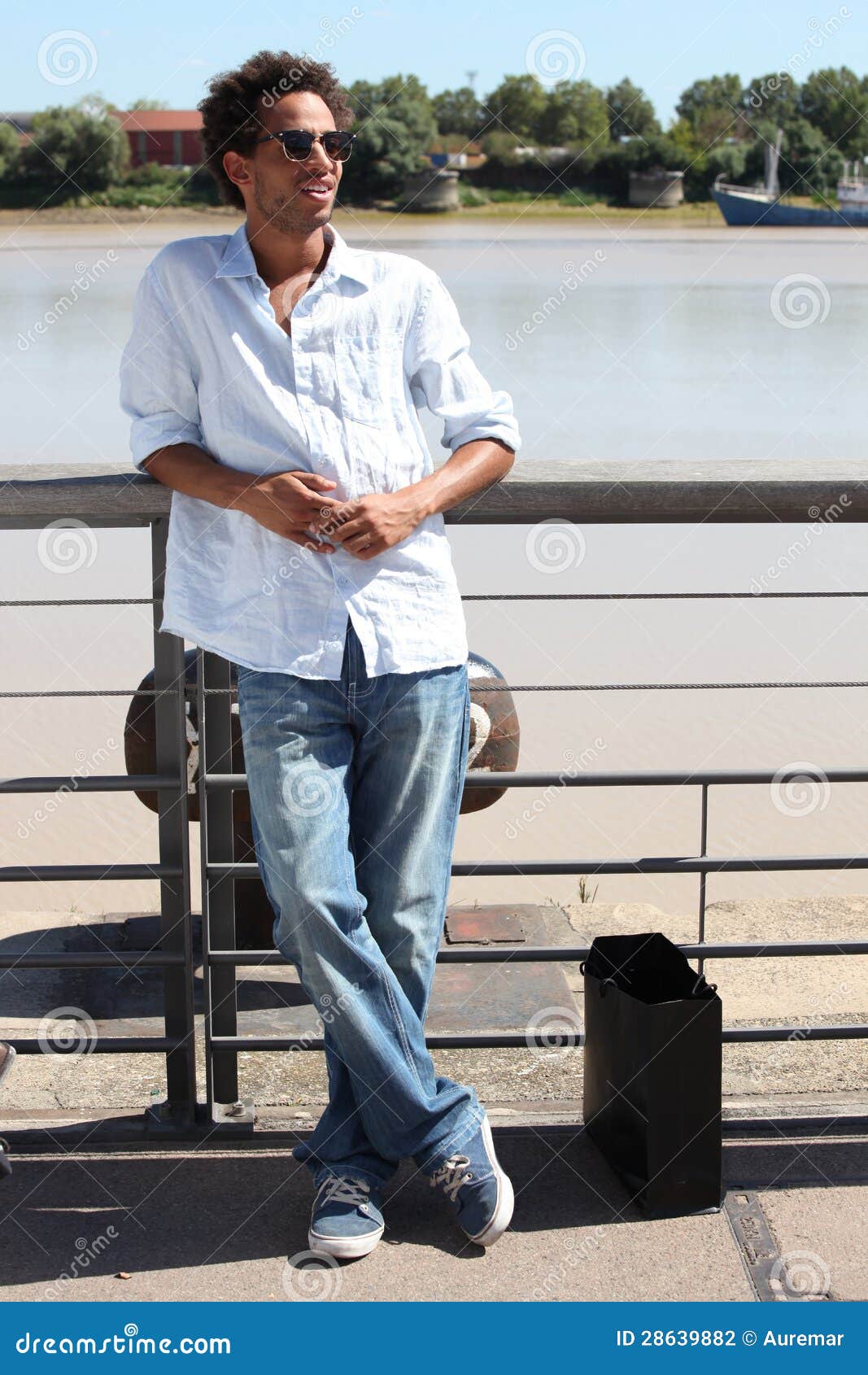 Man Strolling Along the Waterfront Stock Photo - Image of strolling ...