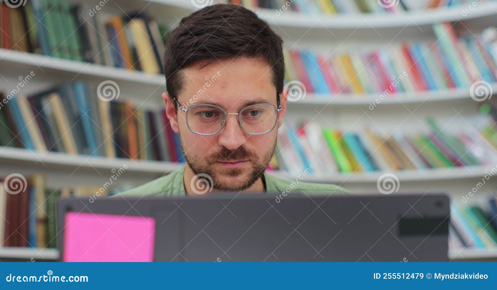 Man Student Preparing Exam and Learning Lessons in Library, Making ...