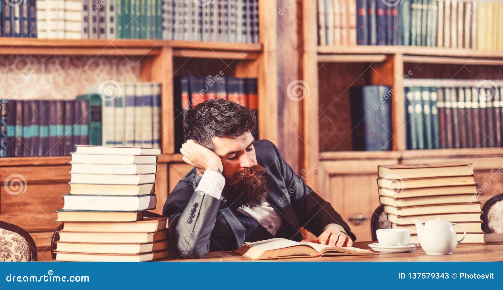 Man Studies Book at His Desk in the Offic Stock Image - Image of ...