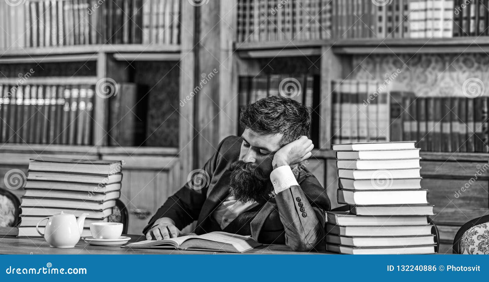 Man Studies Book at His Desk in the Office. Stock Photo - Image of ...