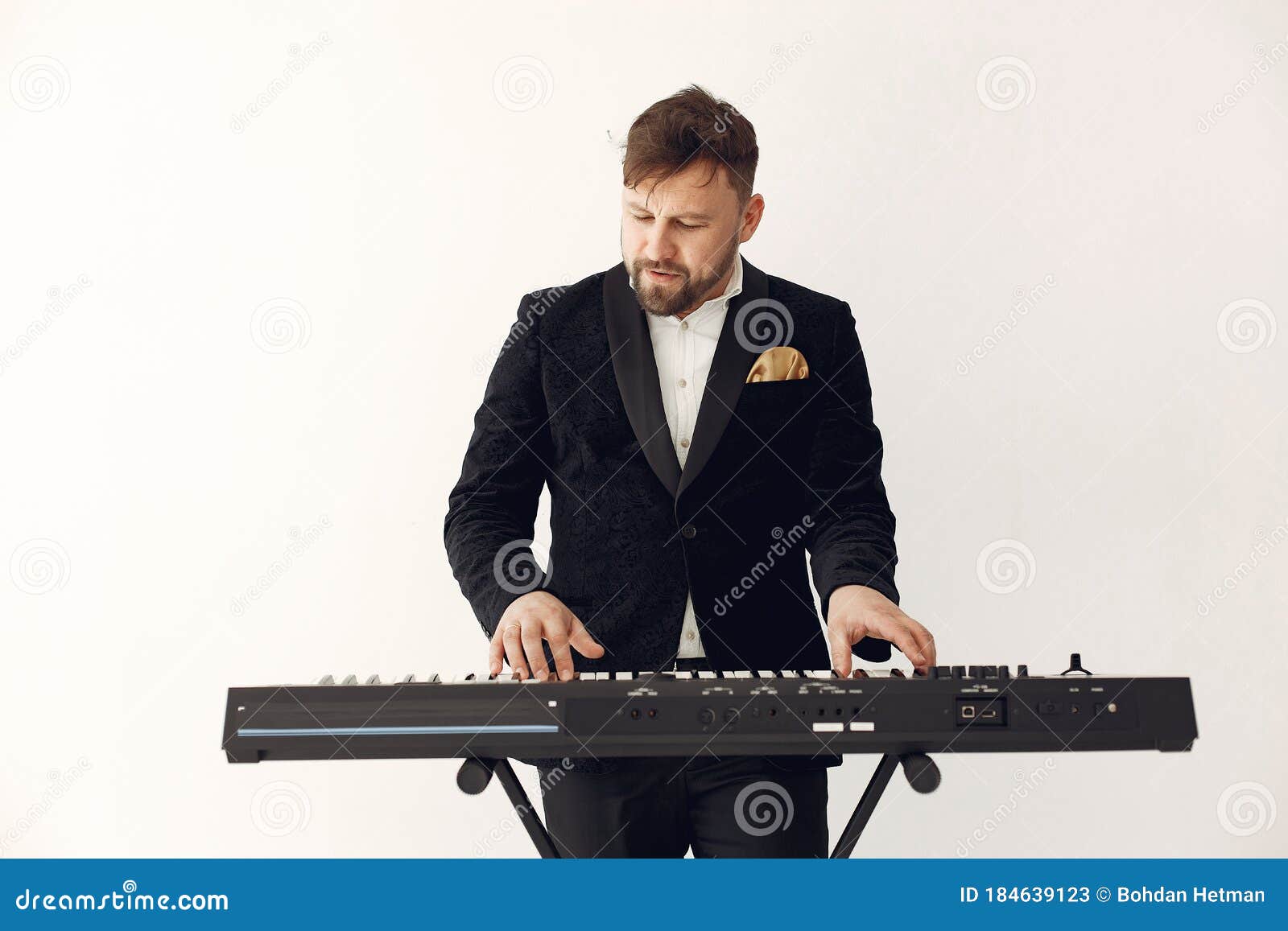 Man in Black Suit Standing with a Electro Keyboard Stock Image - Image ...
