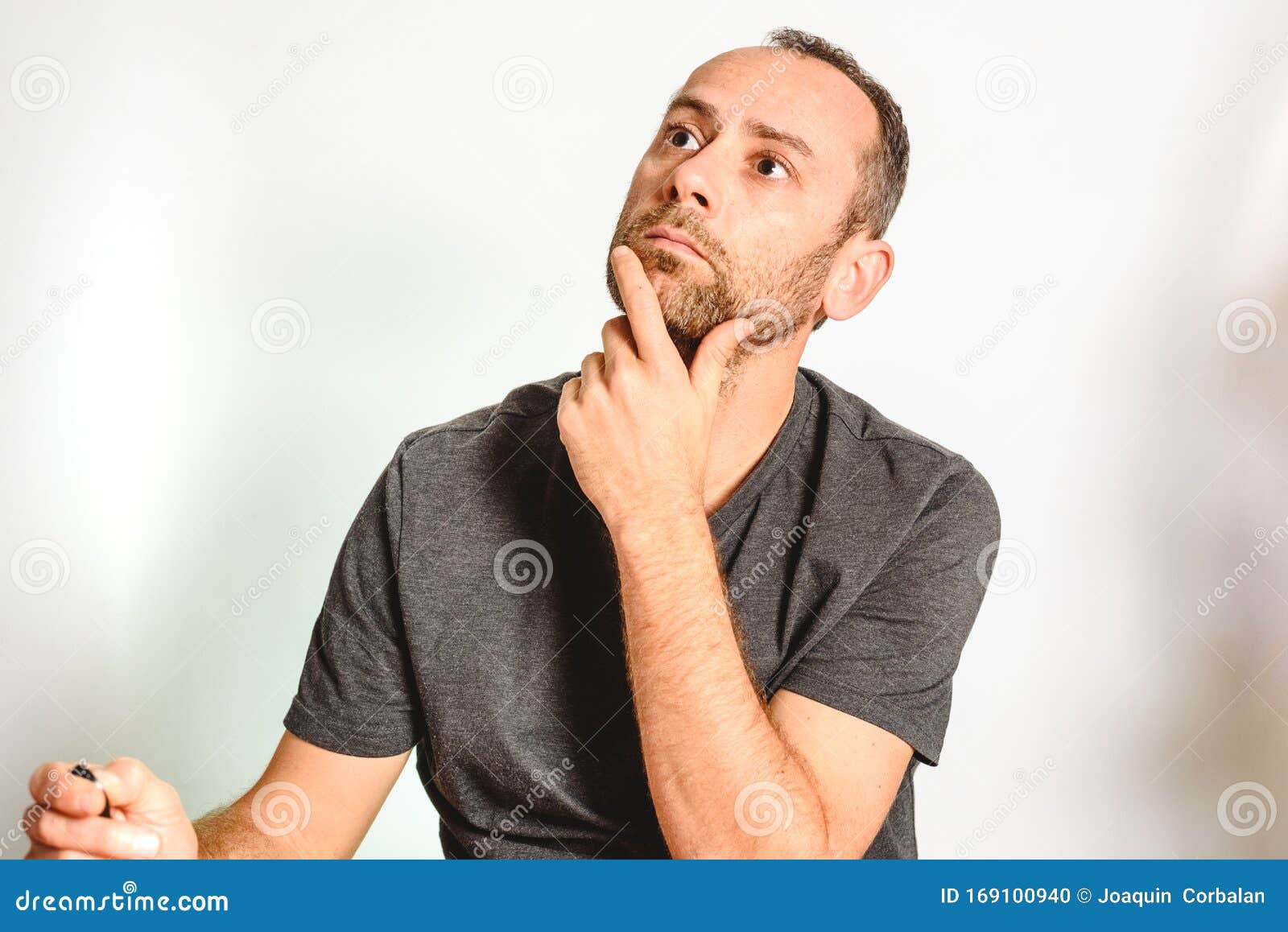Man in Studio, Thoughtful Hand Resting on His Chin, Model Expressions ...
