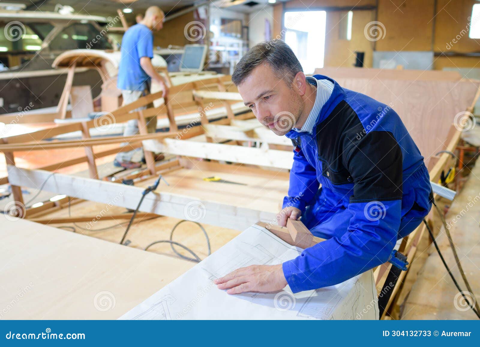Man studying blueprint stock image. Image of factory - 304132733