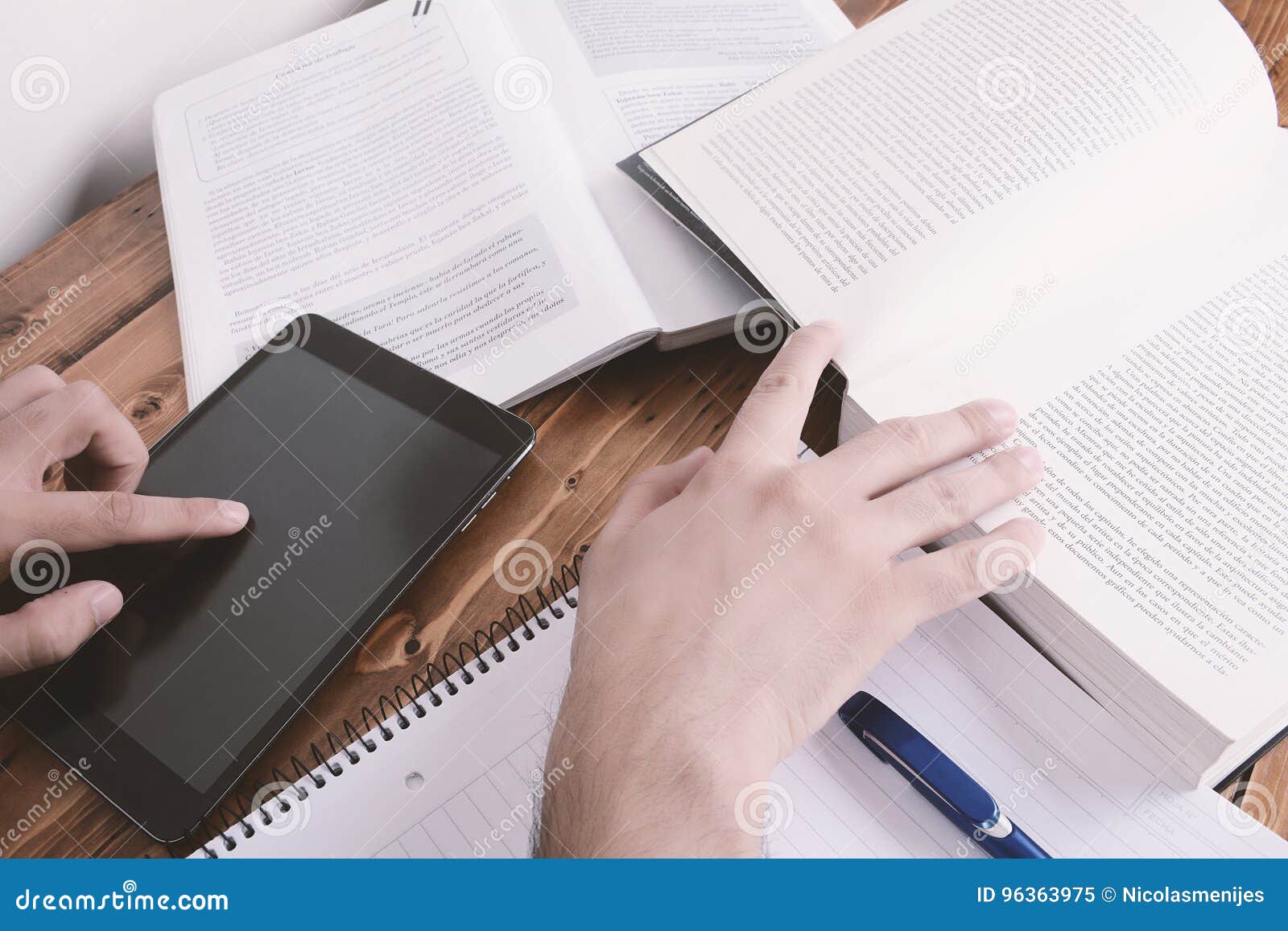 Man studying with tablet. stock image. Image of books - 96363975