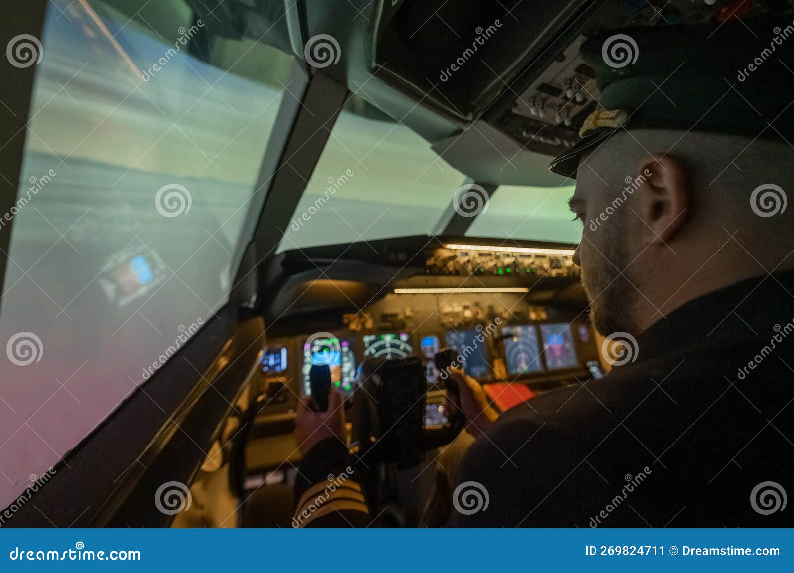 A Man Is Studying To Be A Pilot In A Flight Simulator. Close-up Of Male ...