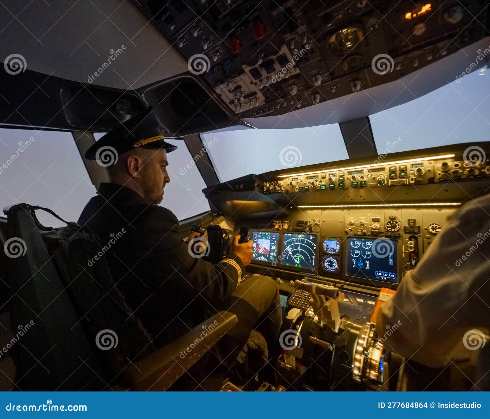 A Man is Studying To Be a Pilot in an Aircraft Simulator. Stock Photo ...