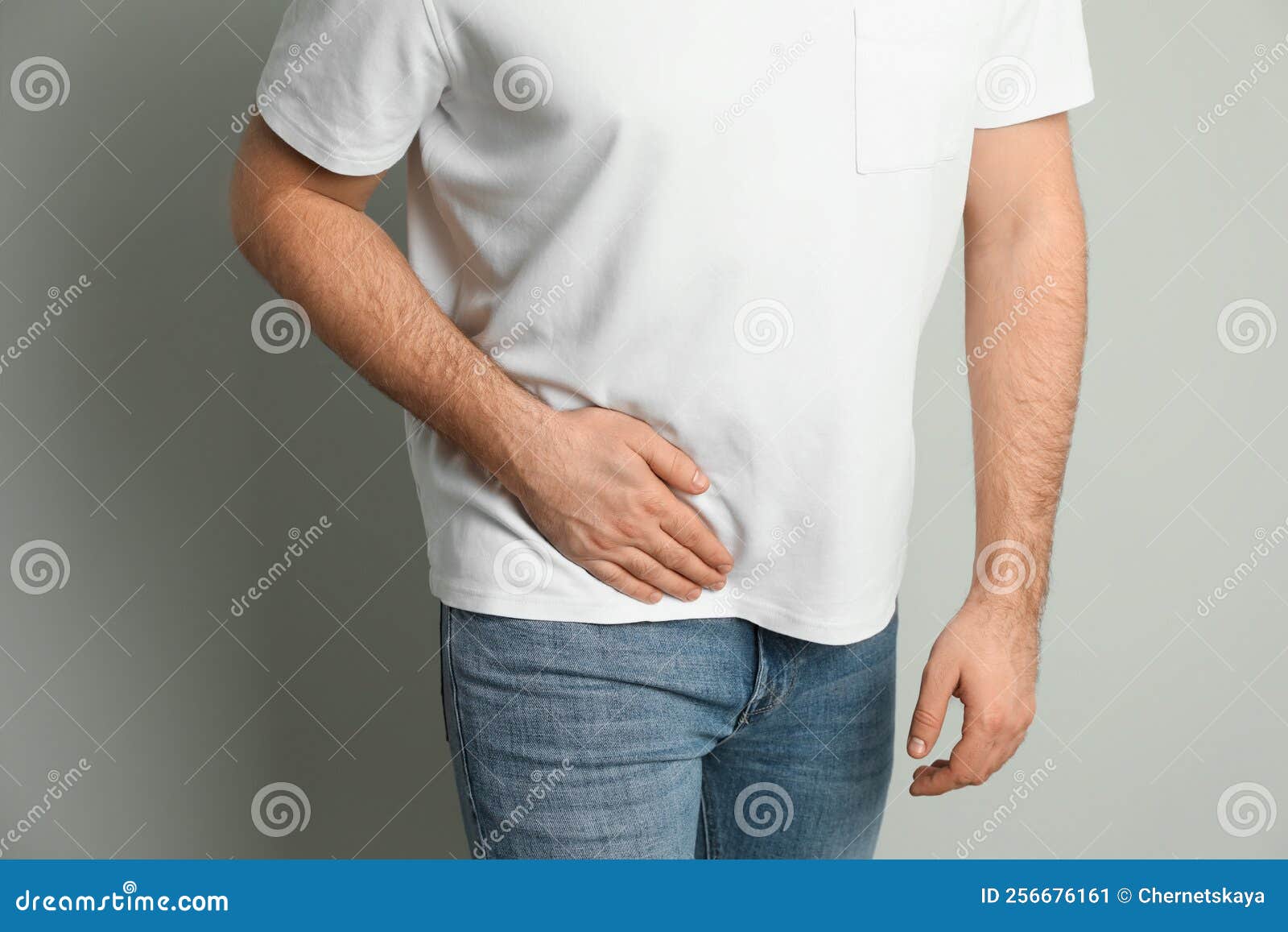 Man Suffering from Acute Appendicitis on Light Grey Background, Closeup ...