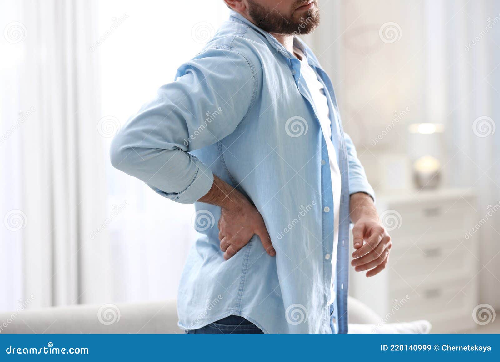 Man Suffering from Back Pain at Home, Closeup. Bad Posture Problem ...