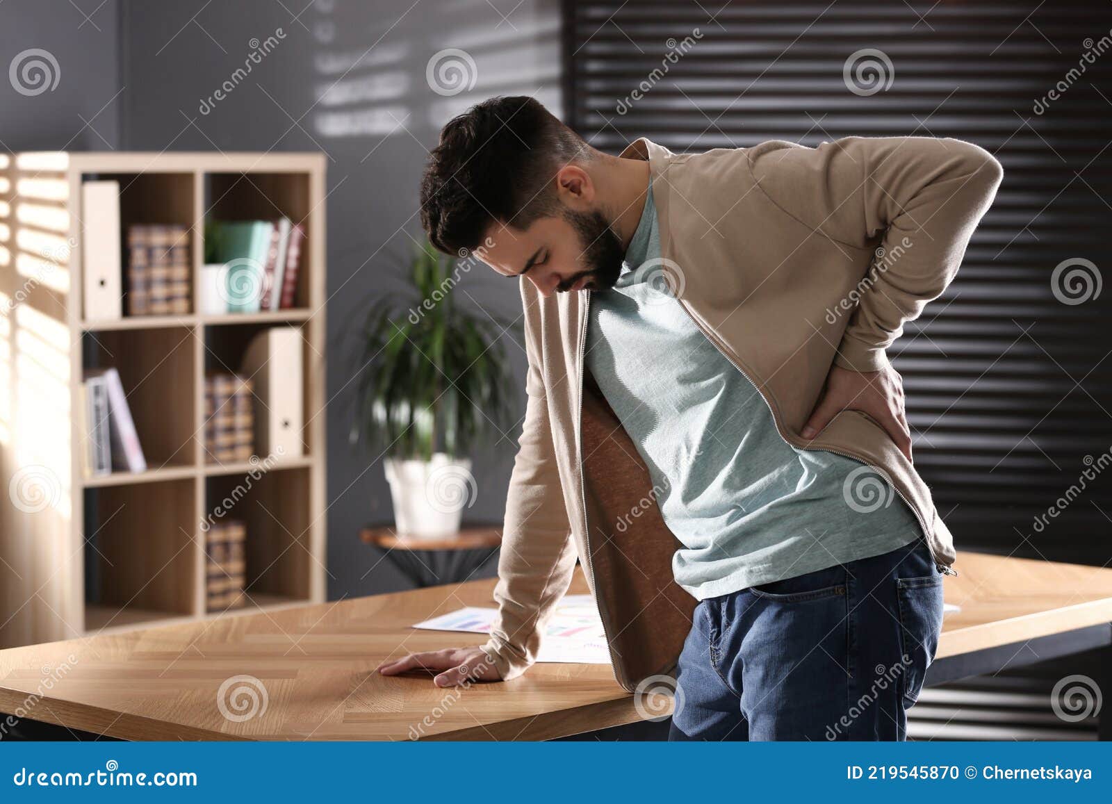 Man Suffering from Back Pain in Office. Bad Posture Problem Stock Photo ...
