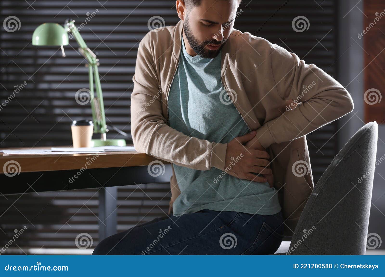 Man Suffering from Back Pain in Office. Bad Posture Problem Stock Photo ...