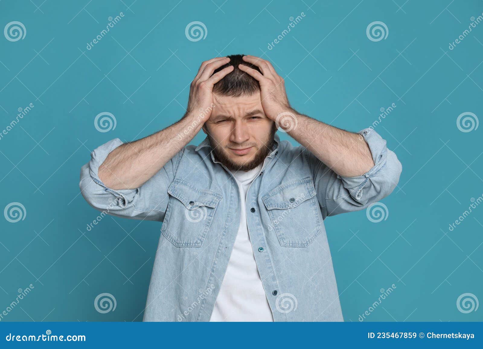 Man Suffering from Headache on Light Blue Background Stock Image ...
