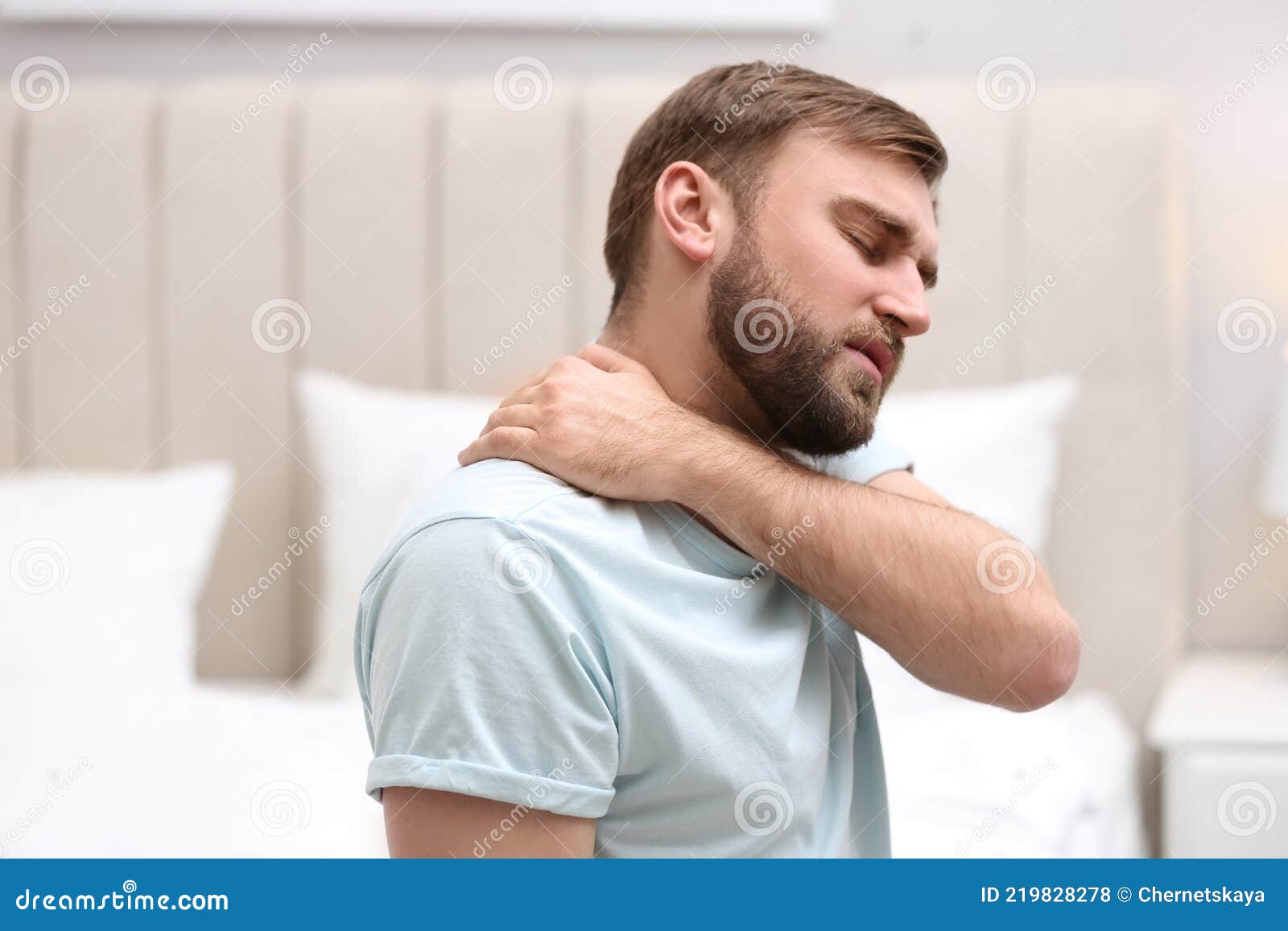 Man Suffering from Neck Pain at Home. Bad Posture Problem Stock Photo ...