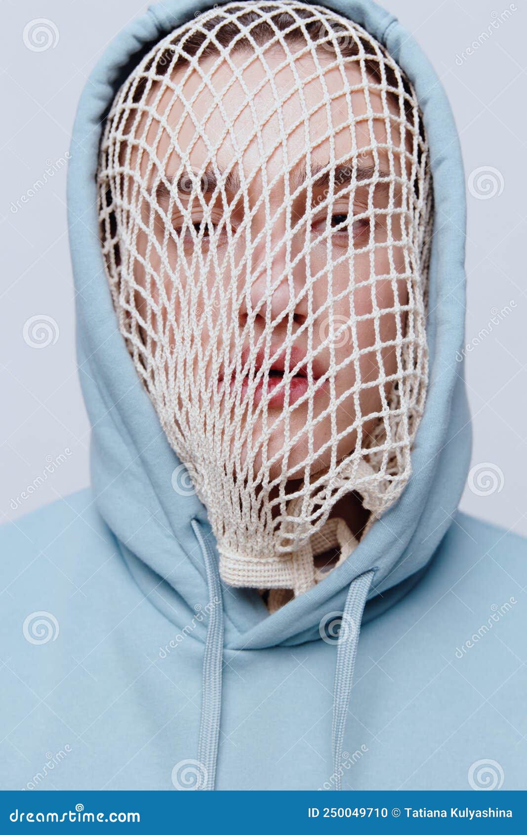 A Man Suffering from Problems with a Mesh on His Face is Standing in a ...