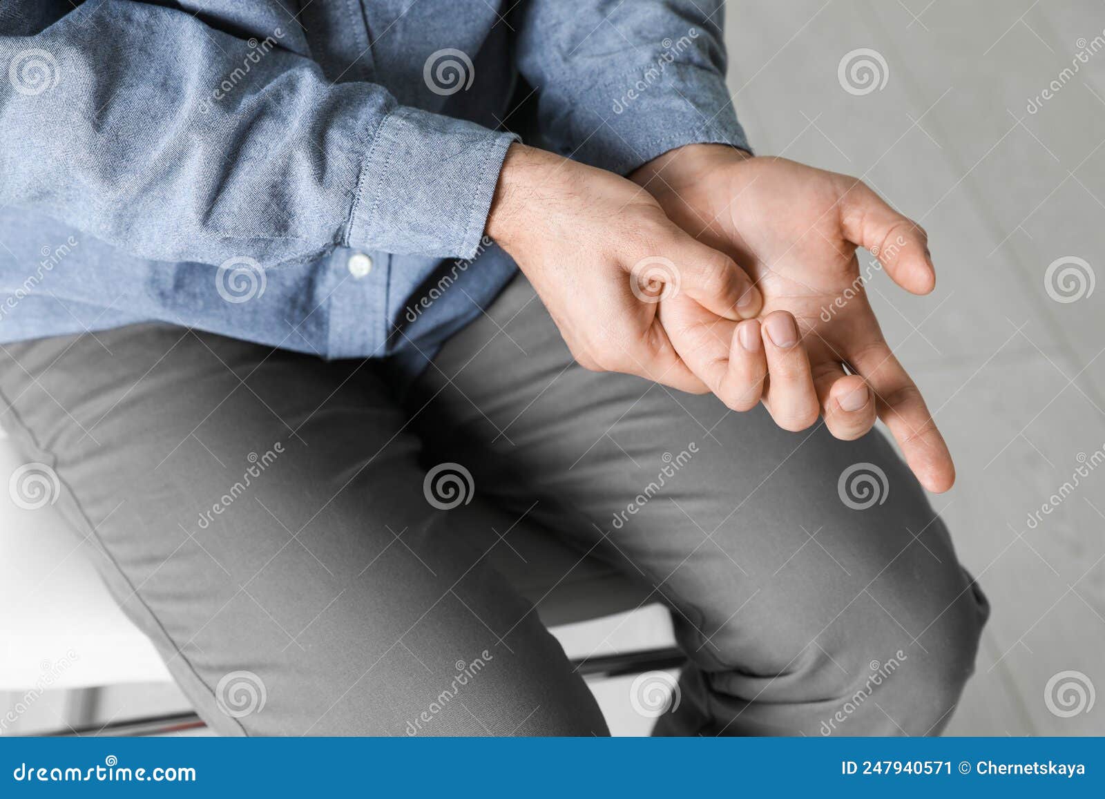 Man Suffering from Trigger Finger Indoors, Closeup Stock Image - Image ...