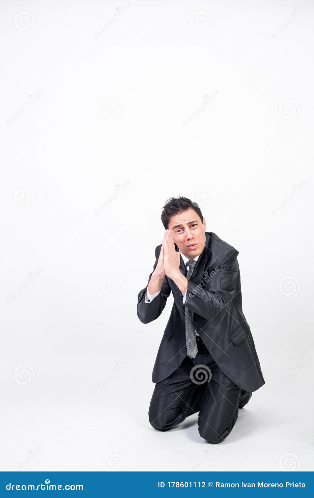 Man in suit begging stock photo. Image of adult, isolated - 178601112