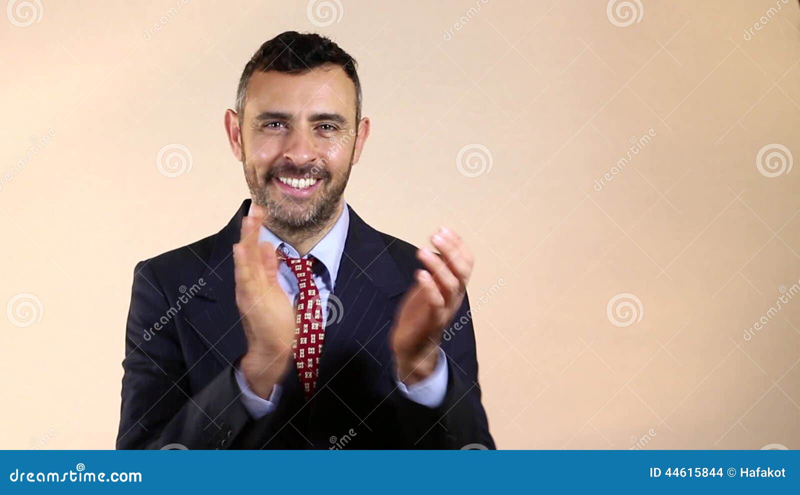 Man in suit clapping hands stock footage. Video of looking - 44615844