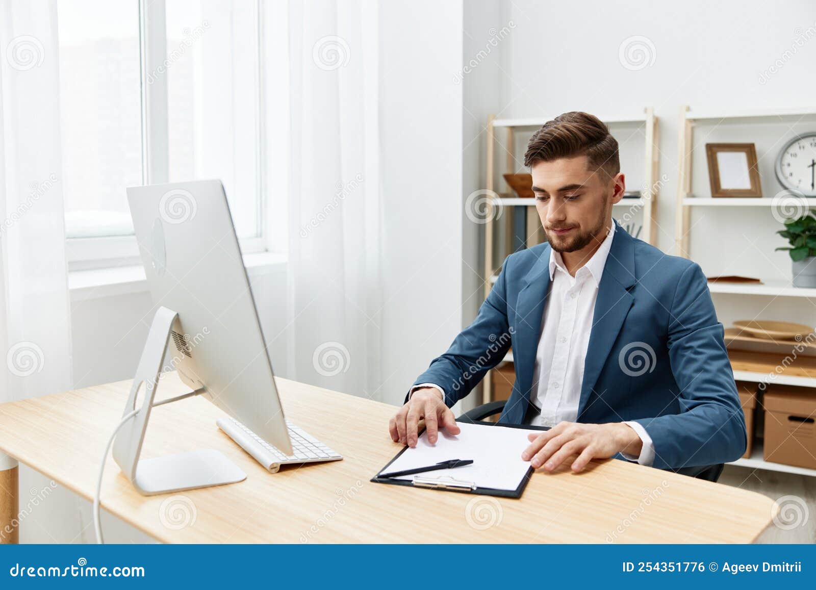 A Man in a Suit Computer Desktop Work Self-confidence Paper Folder ...
