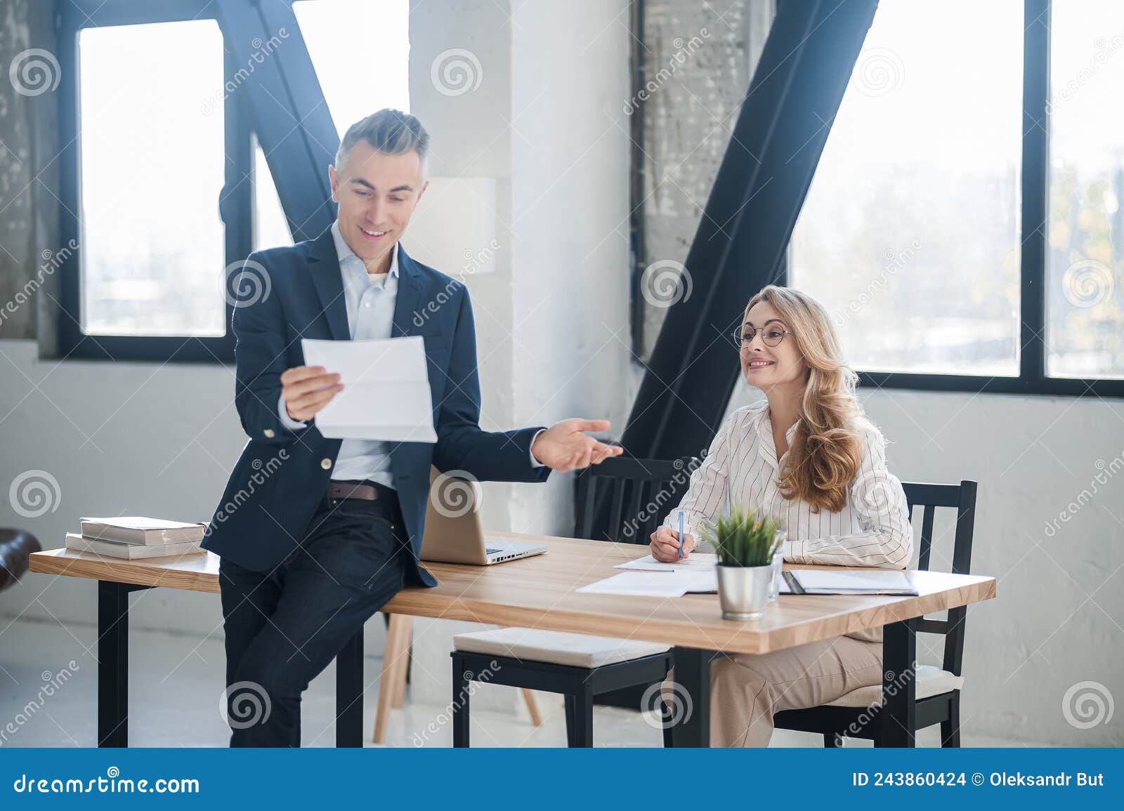 A Man in a Suit with Documents in Hands Stock Photo - Image of office ...