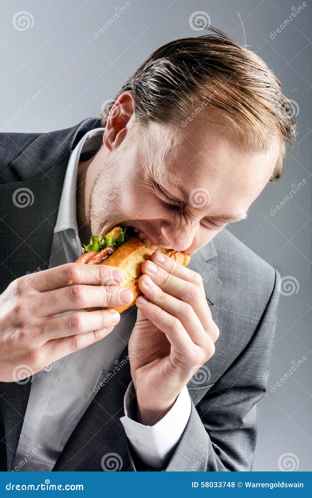 Man in Suit Eats BLT Eagerly Stock Photo - Image of lettuce, funny ...