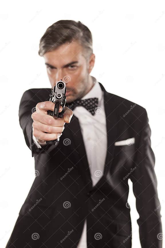 Man in a suit with a gun stock photo. Image of security - 58744096