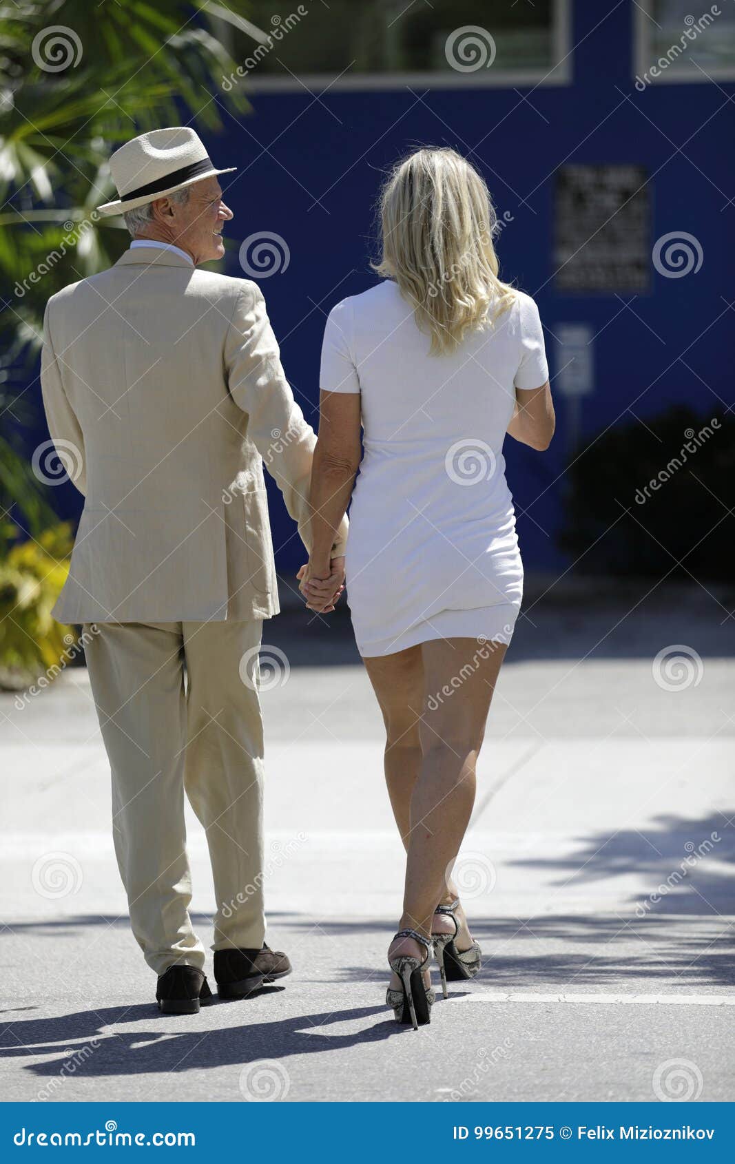 Rear Shot Of A Mature Couple Walking On The Street Stock Image Image