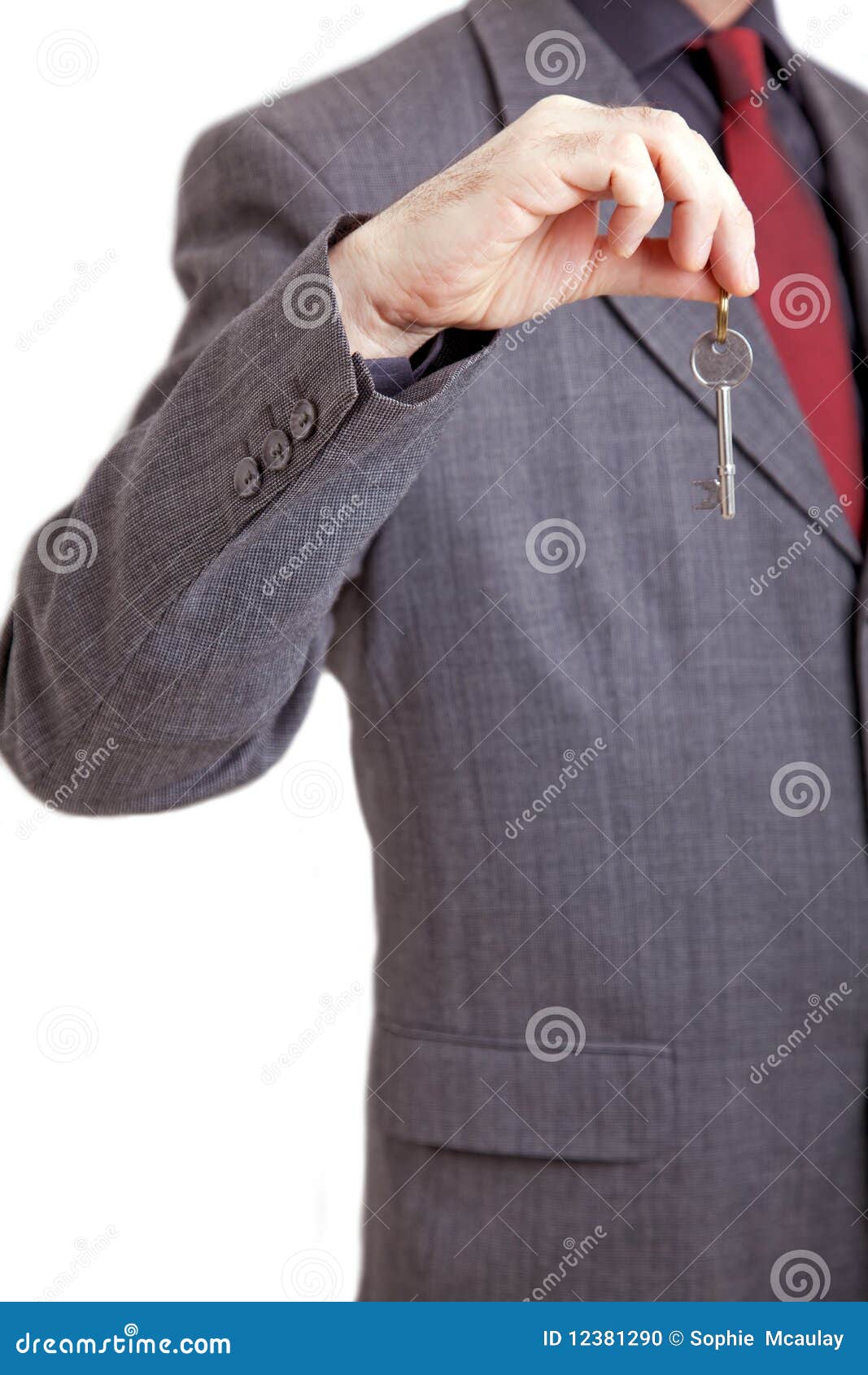 Man in suit holding key stock photo. Image of home, property - 12381290