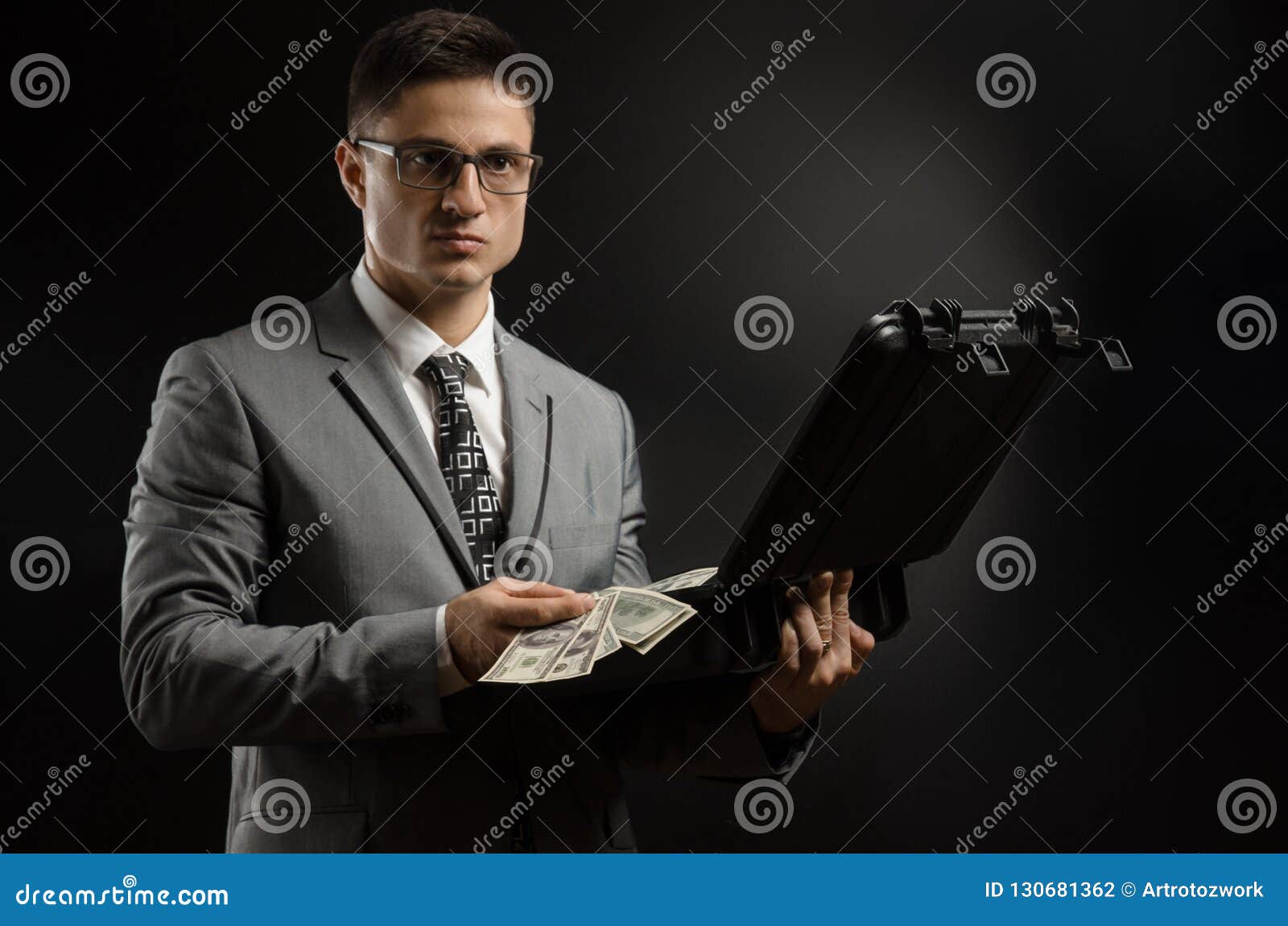 A Man in a Suit Jacket with a Case of Money Stock Photo - Image of bail ...