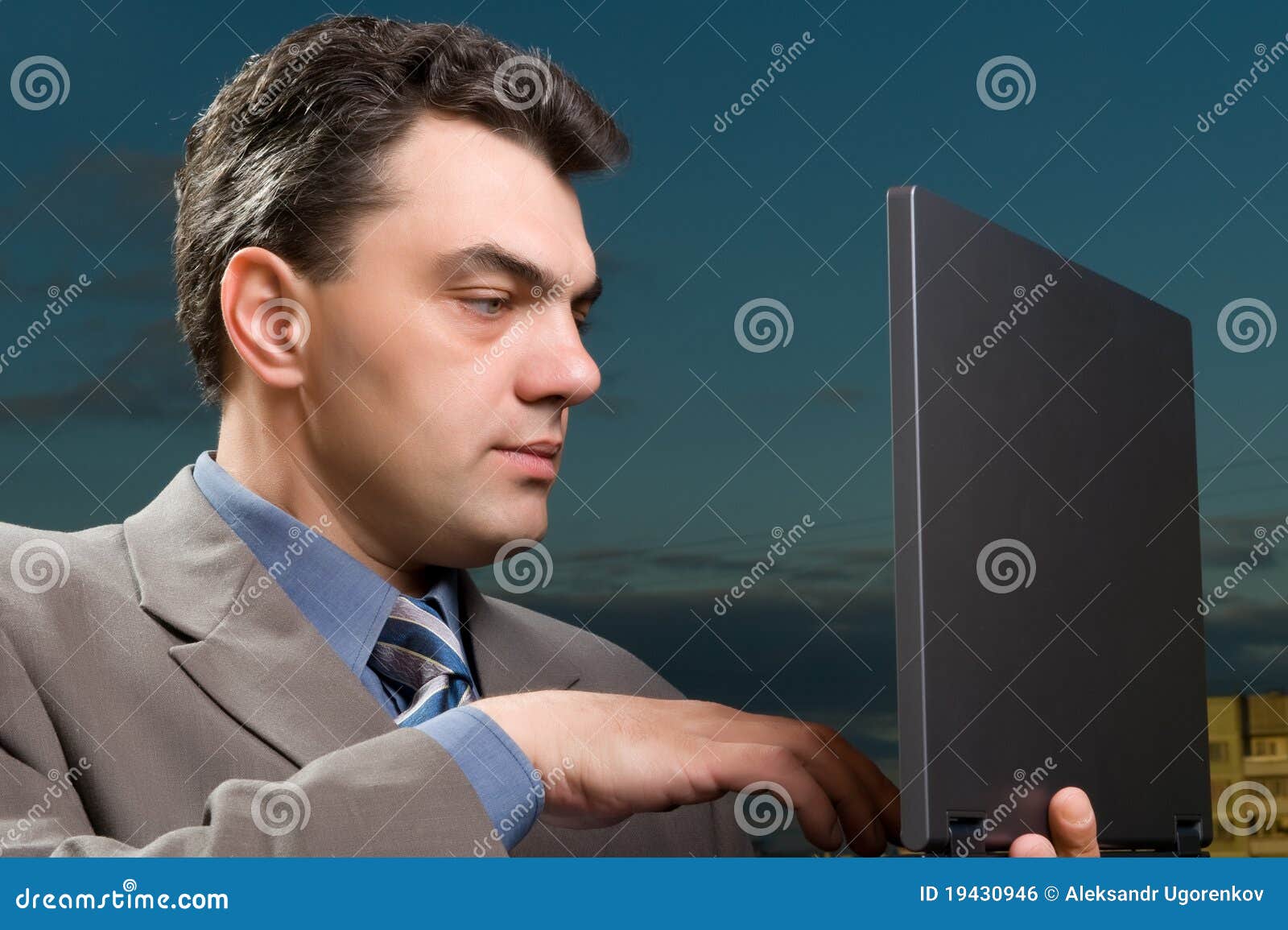 Man in a suit with laptop stock photo. Image of portrait - 19430946