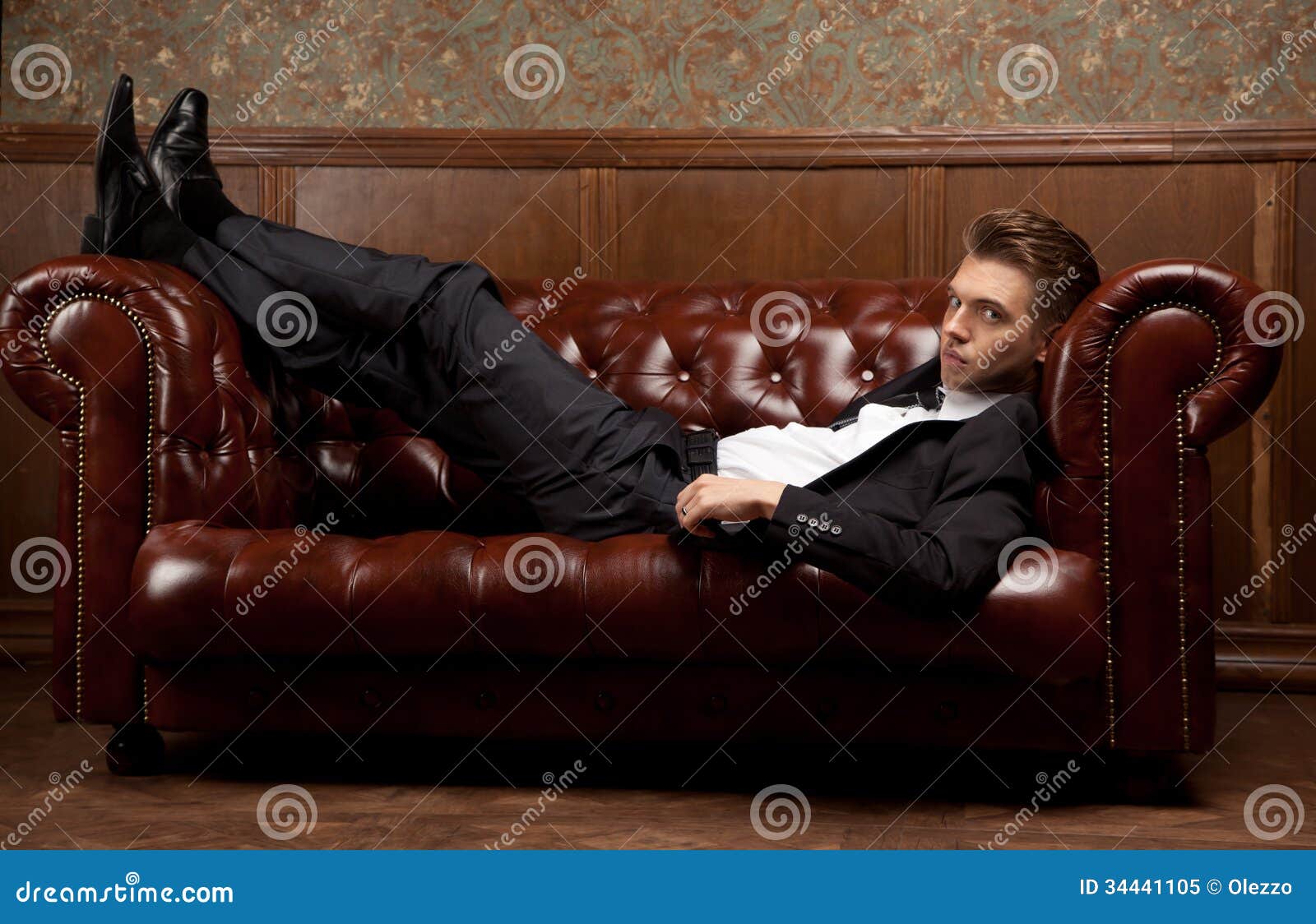 A Man in a Suit Lying on the Couch Stock Image - Image of rich ...