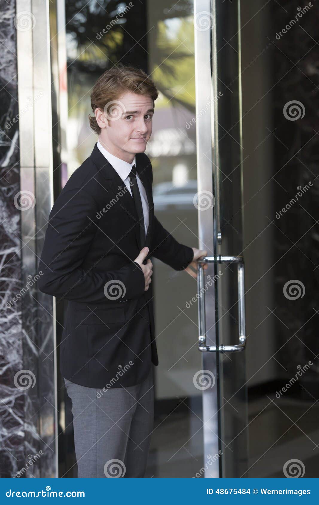 Man in suit opens a door stock photo. Image of fashionable - 48675484 Man in suit opens a door stock photo. Image of fashionable - 48675484