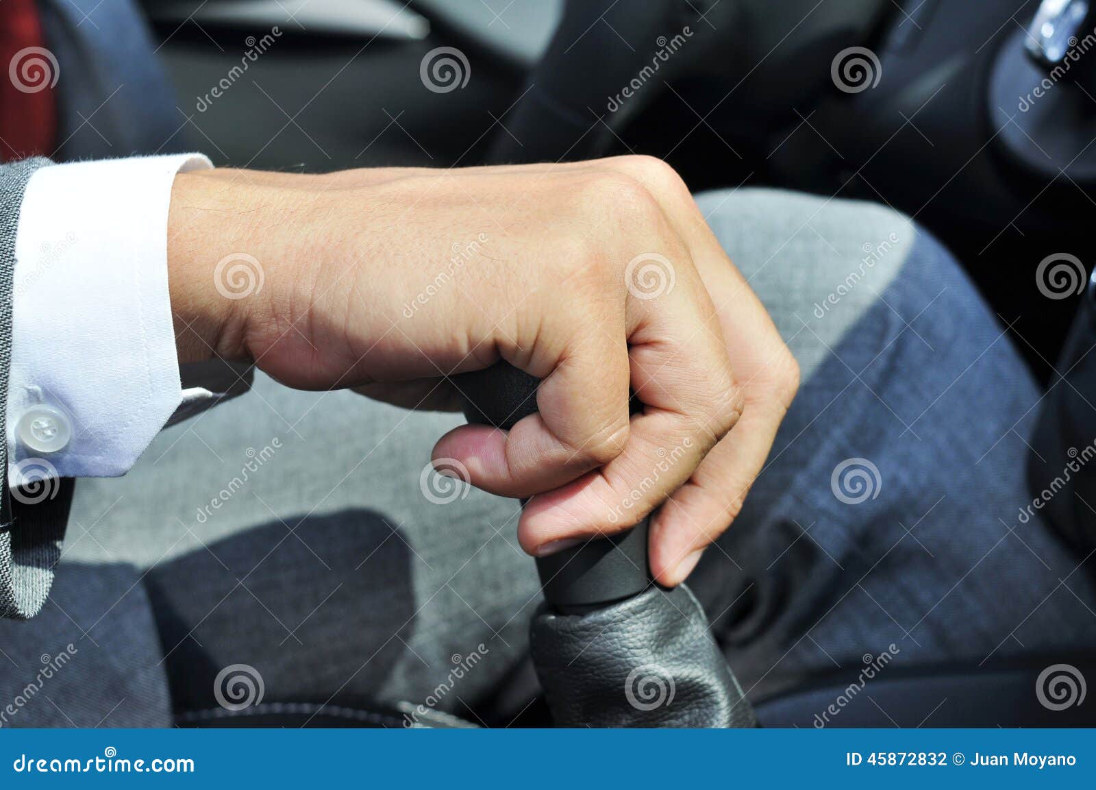 Man in Suit Operating the Parking Brake of a Car Stock Photo - Image of ...