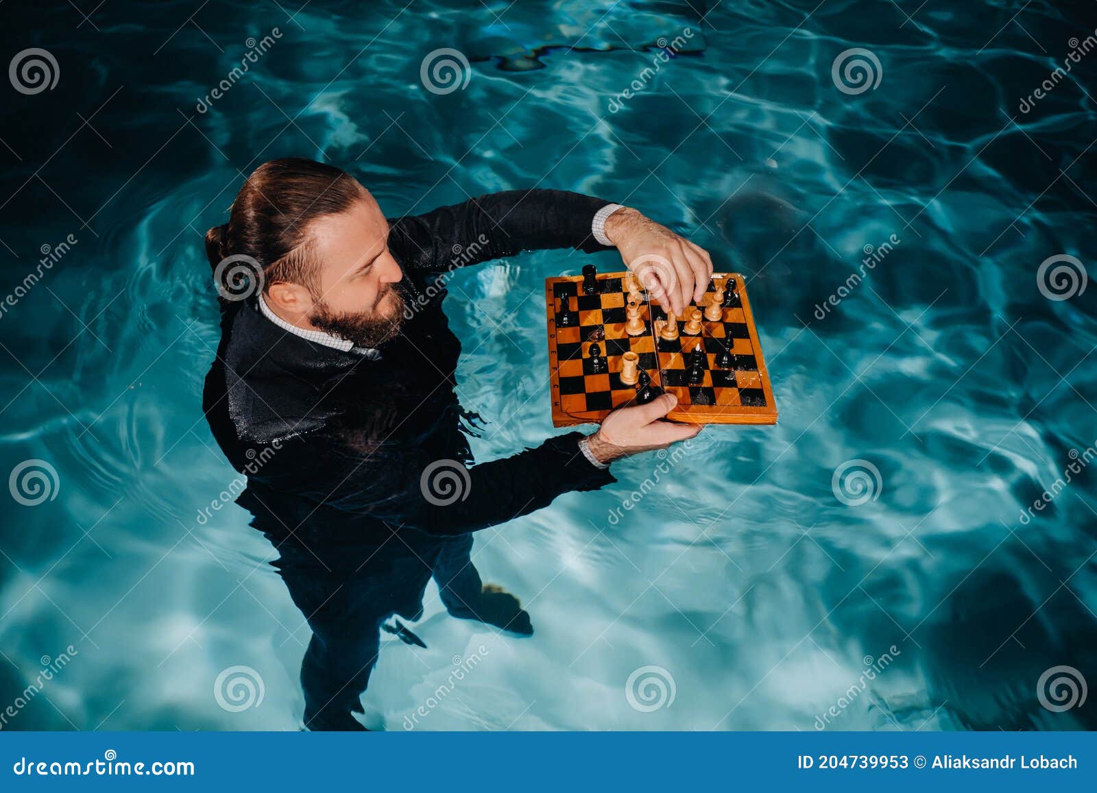A Man in a Suit Plays Chess on the Water in the Pool Stock Image ...