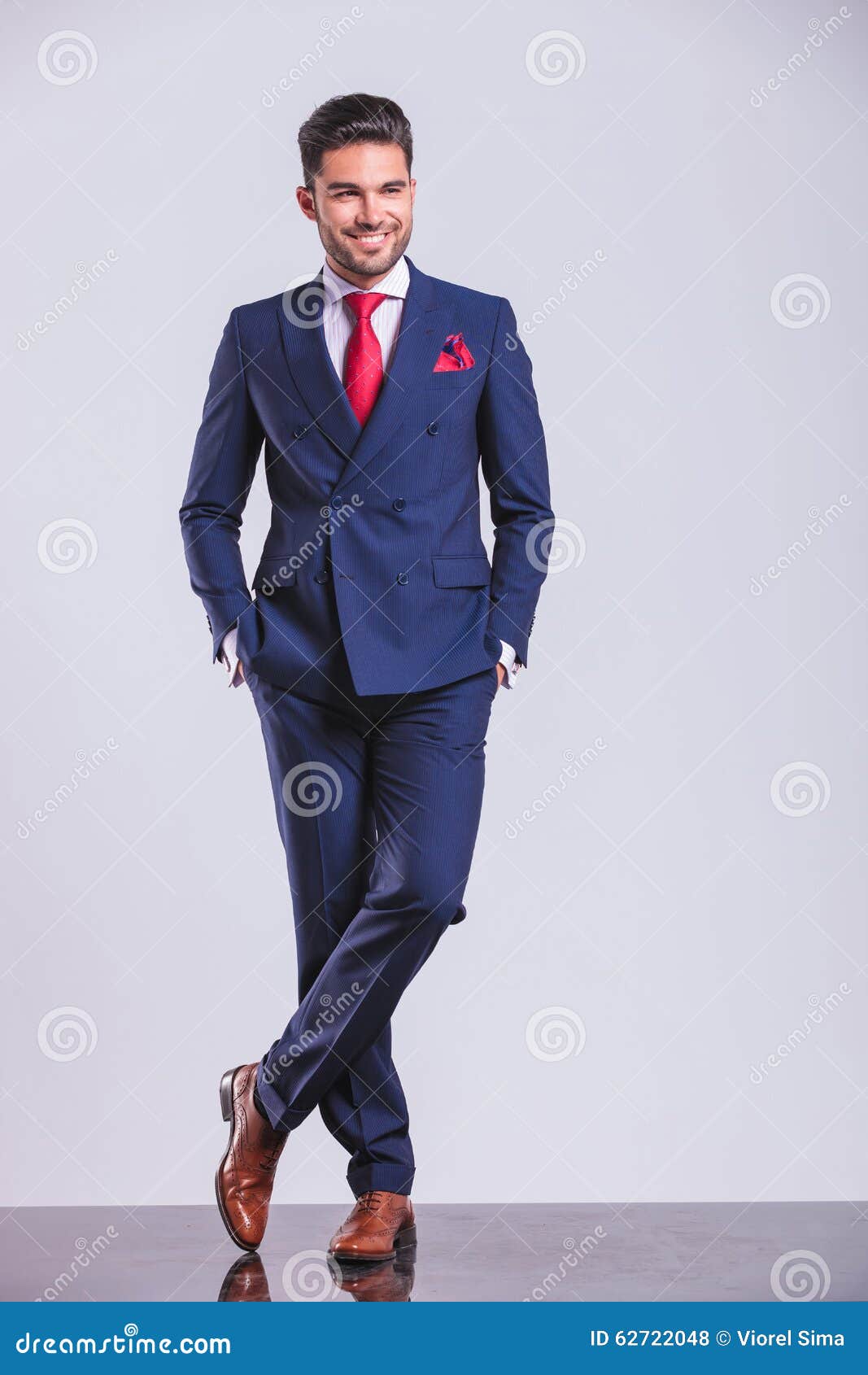 Man in Suit Posing Legs Crossed while Having Hands in Pockets Stock ...